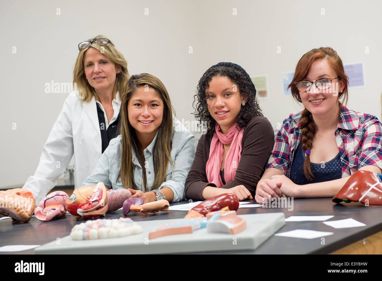 Biology students in classroom with teacher Stock Photo - Alamy