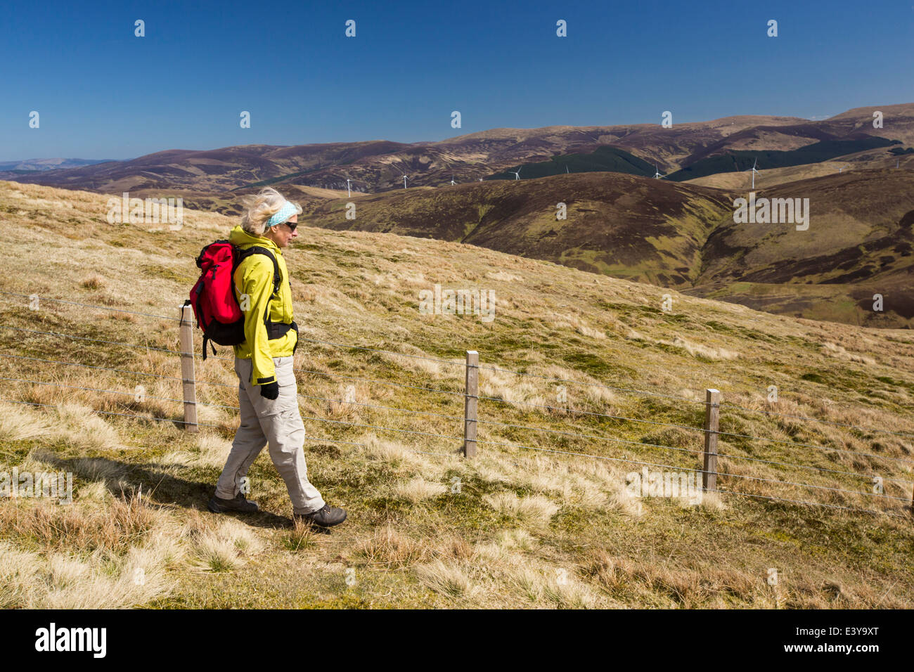 Hill walker and wind turbine hi-res stock photography and images - Alamy