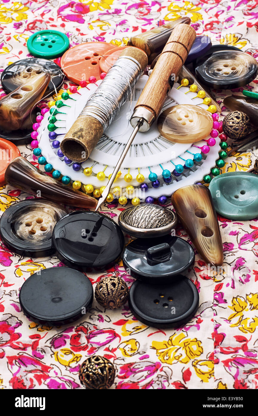 different buttons and zipper on the background of sewing tool Stock ...