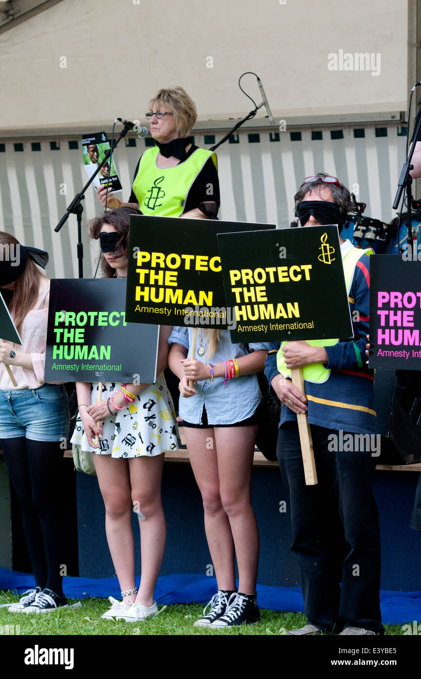 People holding Amnesty International placards at Leamington Peace ...
