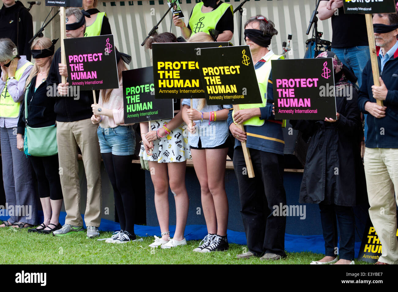 People holding Amnesty International placards at Leamington Peace ...