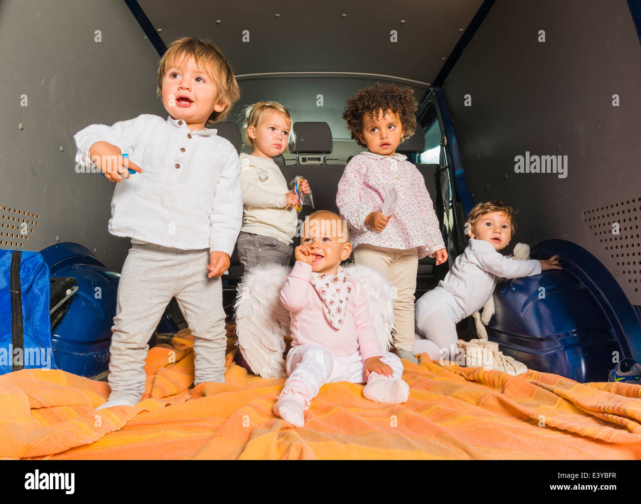 Young children in the back of a Van Stock Photo - Alamy
