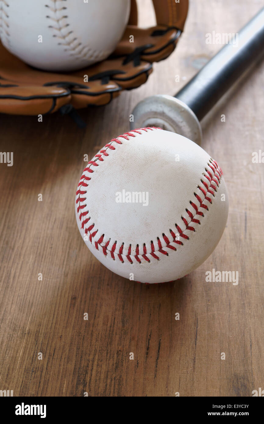 Old well used baseball glove and bat Stock Photo - Alamy