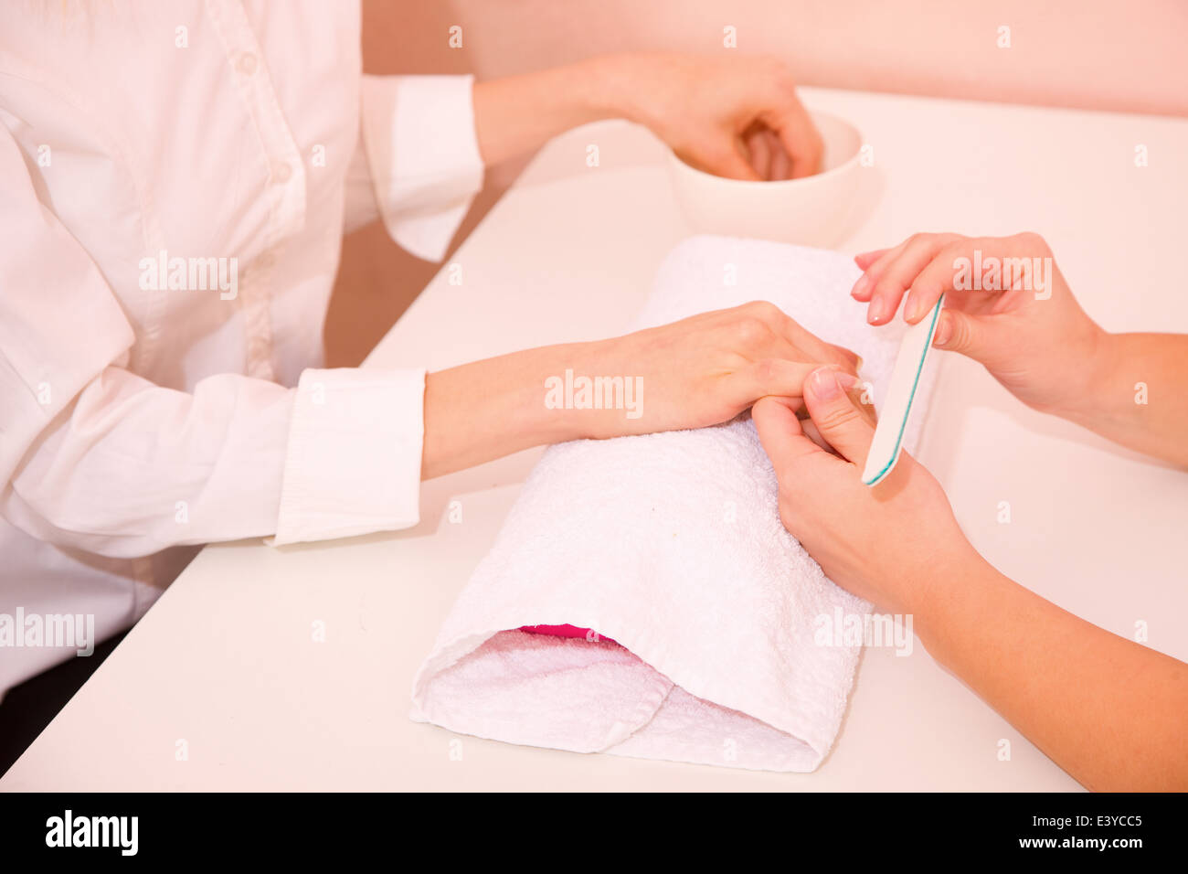 Woman receiving manicure treatment Stock Photo - Alamy