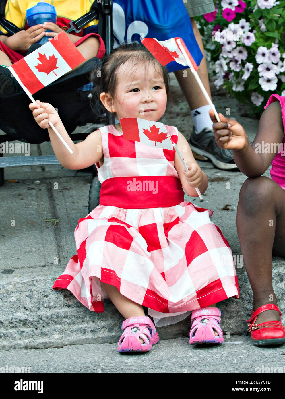 Montreal, Canada. 1st July, 2014. A girl attends a parade to celebrate ...