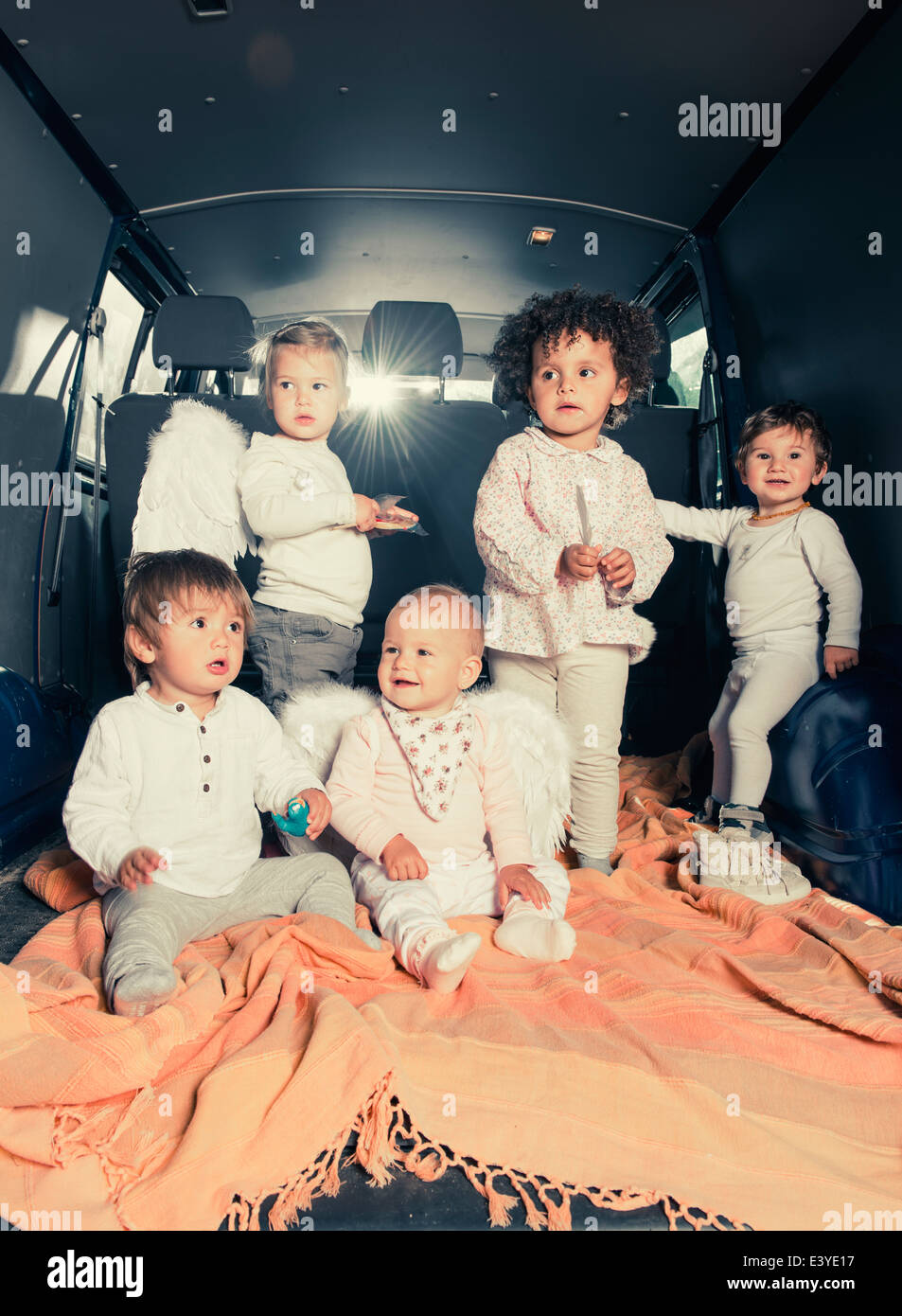 Children in the back of a van Stock Photo - Alamy