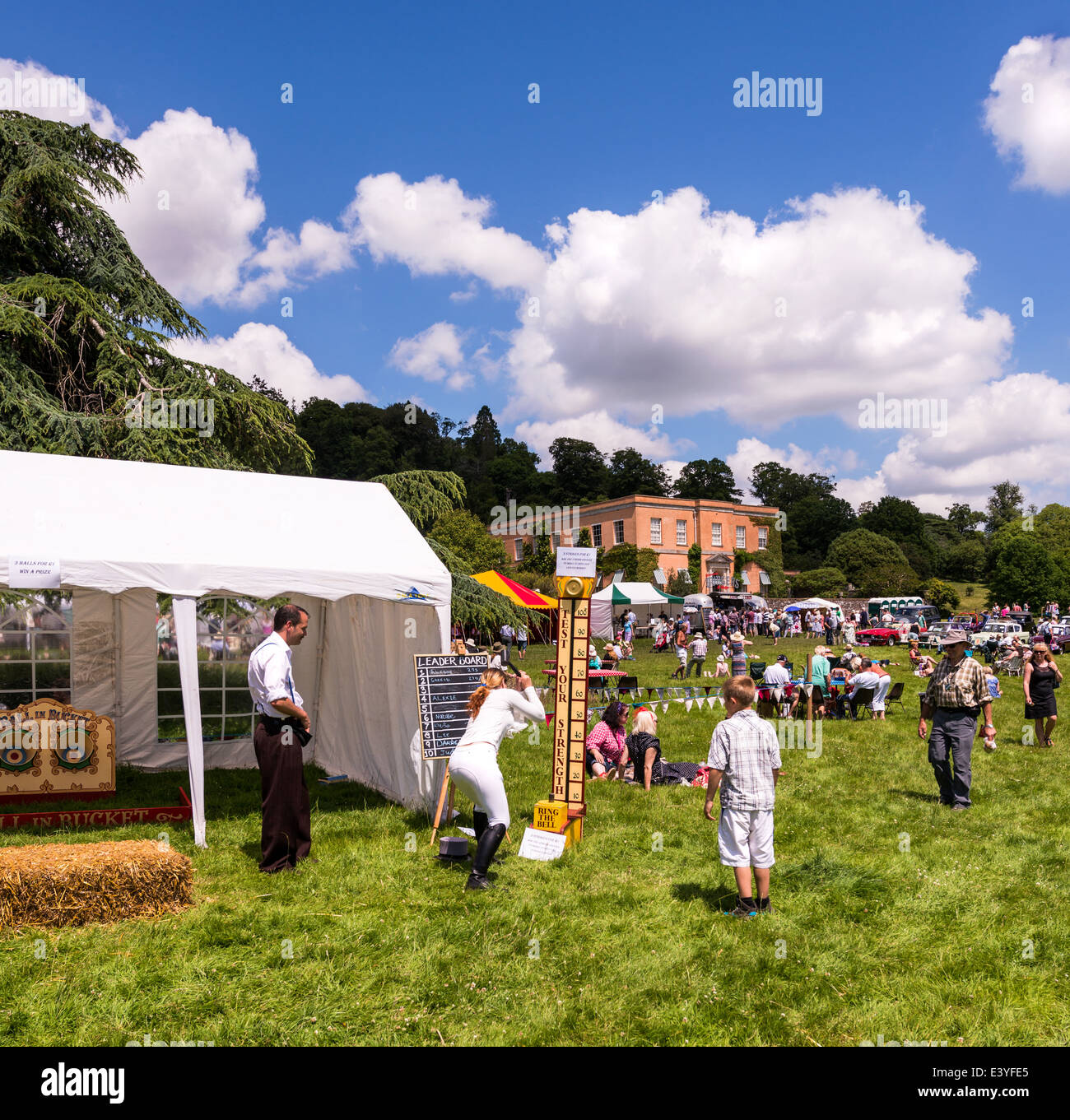 East Devon, England. A Test Your Strength game at a Fete and garden ...