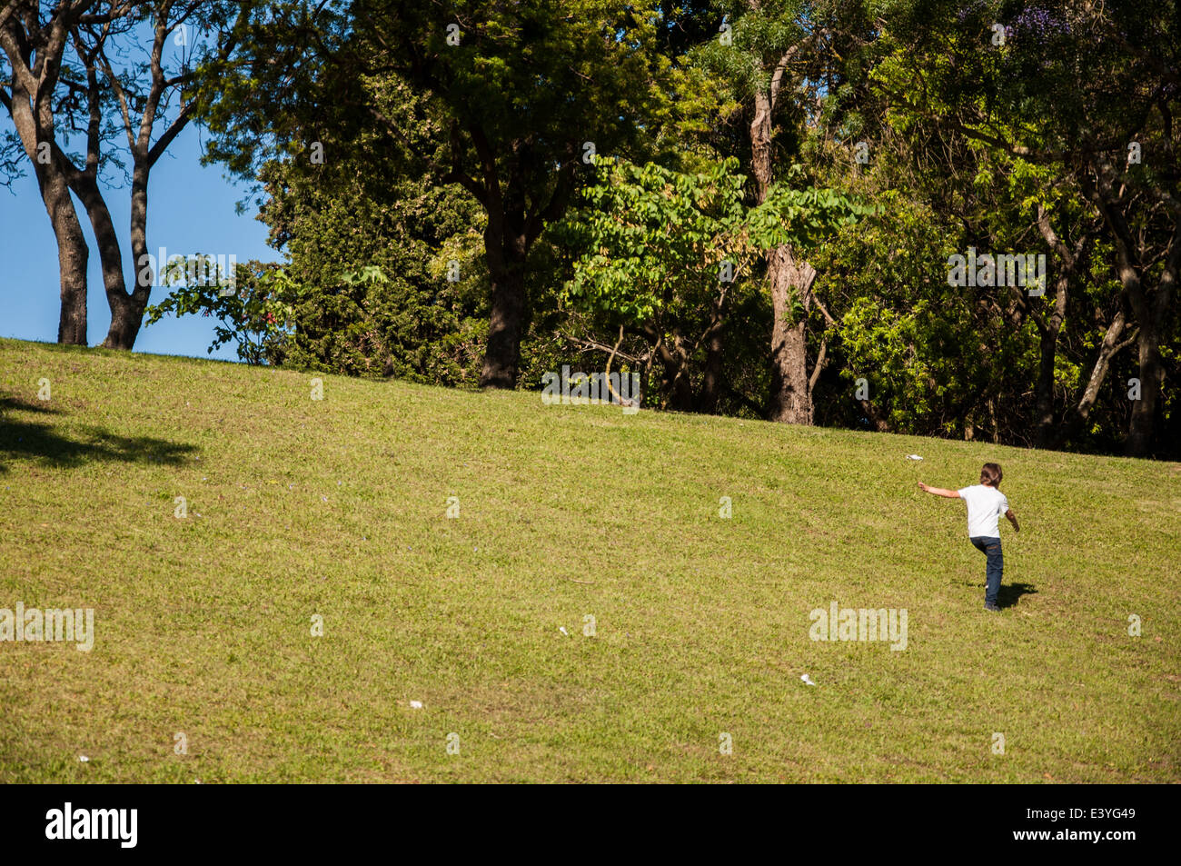 Kid running on the grass Stock Photo - Alamy