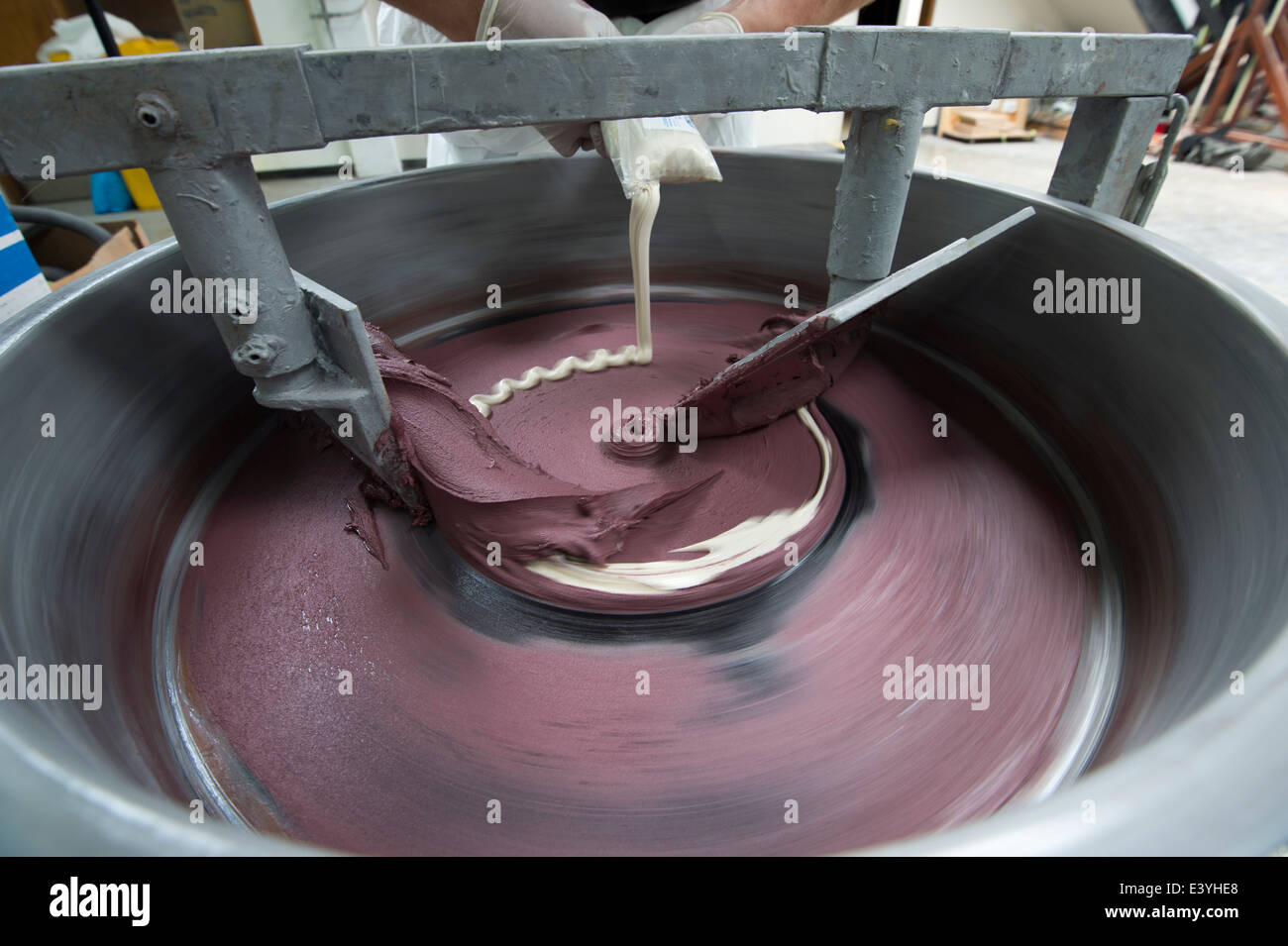 Polyester body filler mixed in a machine Stock Photo - Alamy