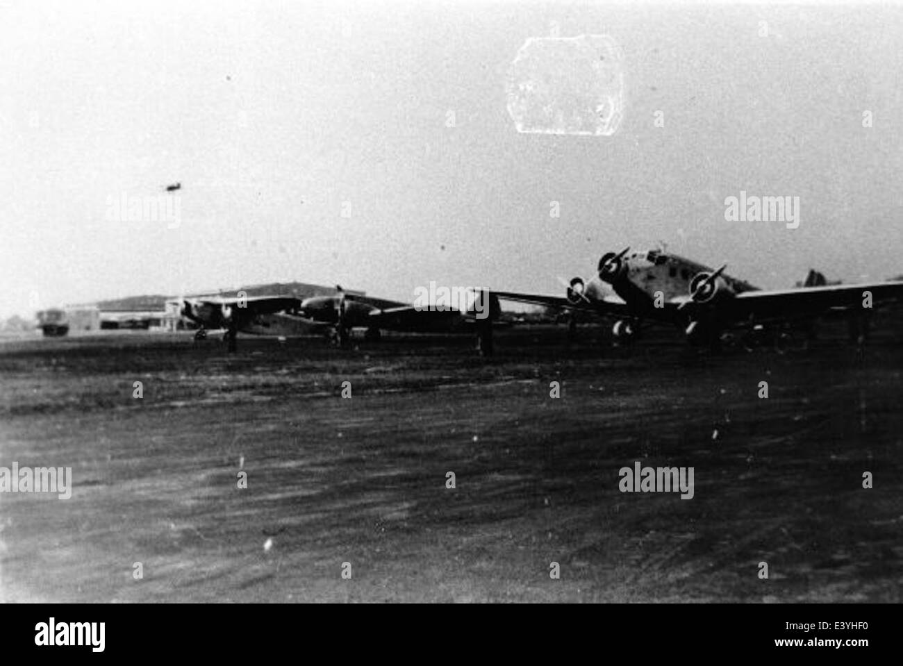 The photograph captures a comparison of trimotor aircraft and the ...
