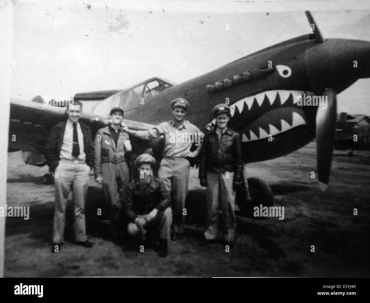 Photograph of a P-40 aircraft with Orin Welch, Dick Rossi, Charlie ...