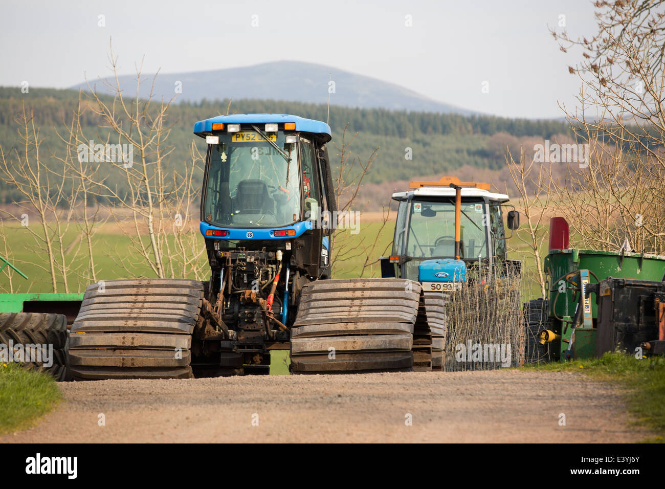 Tractors used to mine a raised bog being harvested for peat near ...