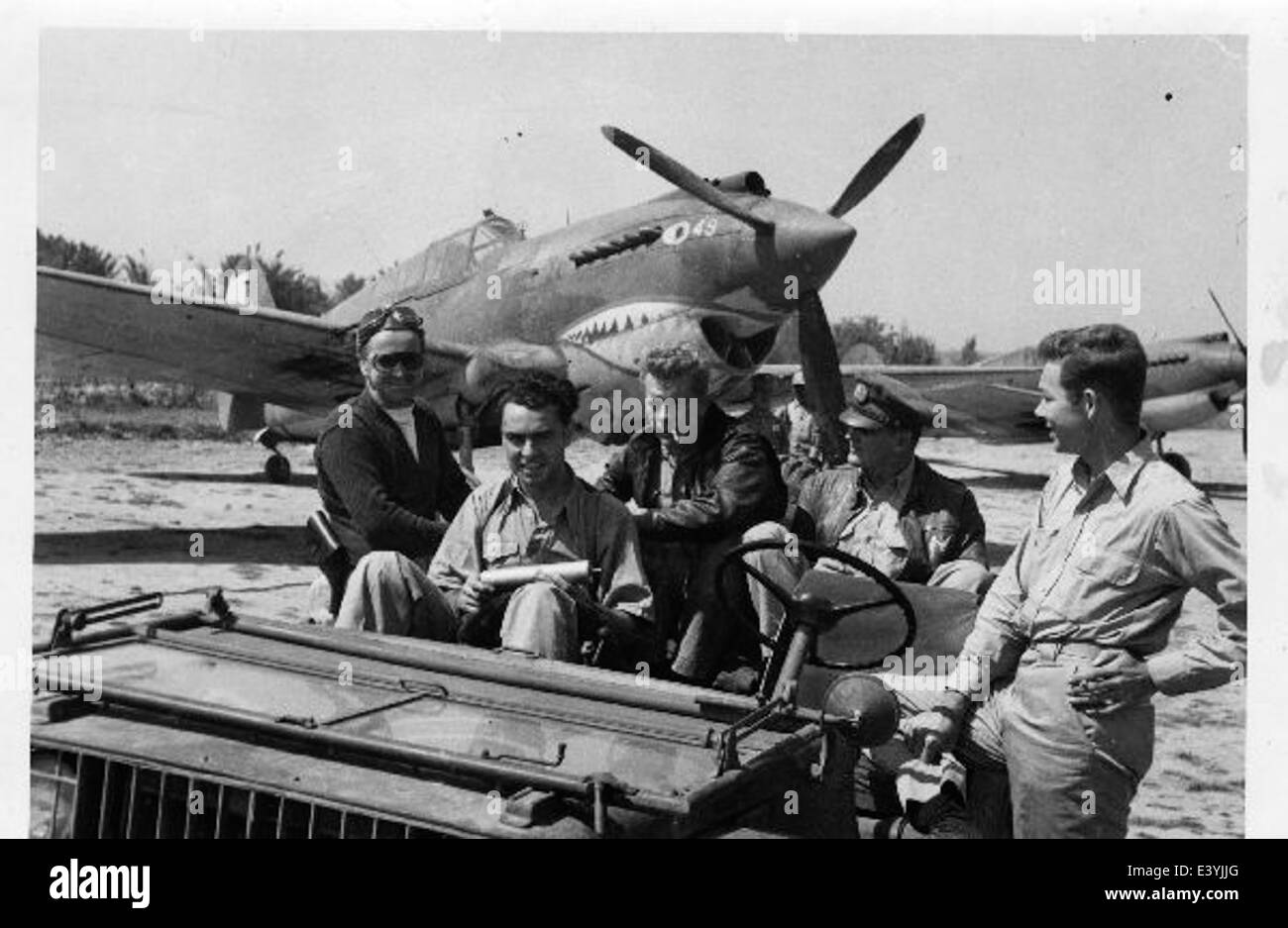 Pilots of the Flying Tigers with their P-40 aircraft in flight. The P ...