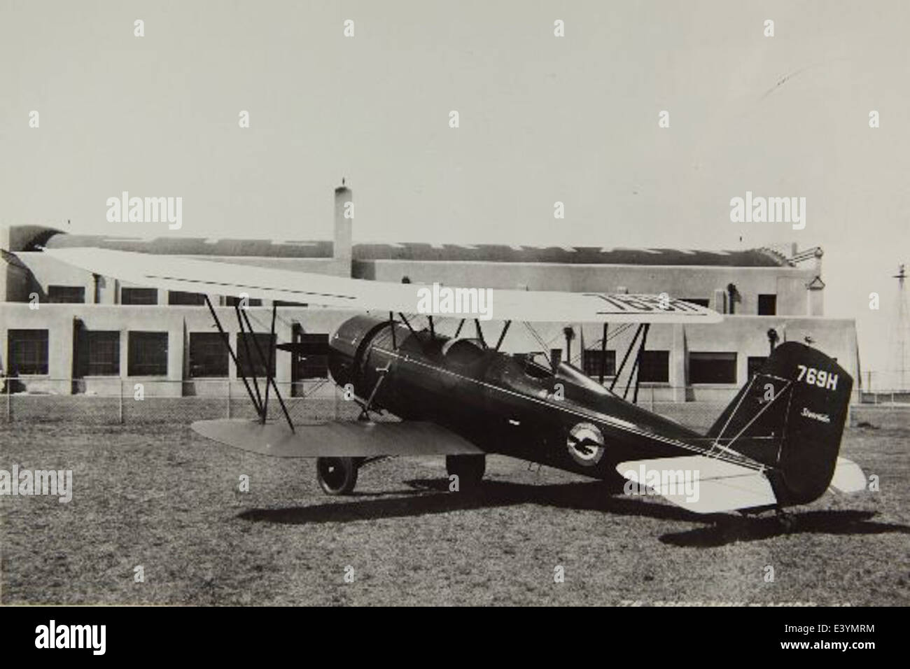 This photograph depicts a Stearman 4-D, an early biplane used for ...