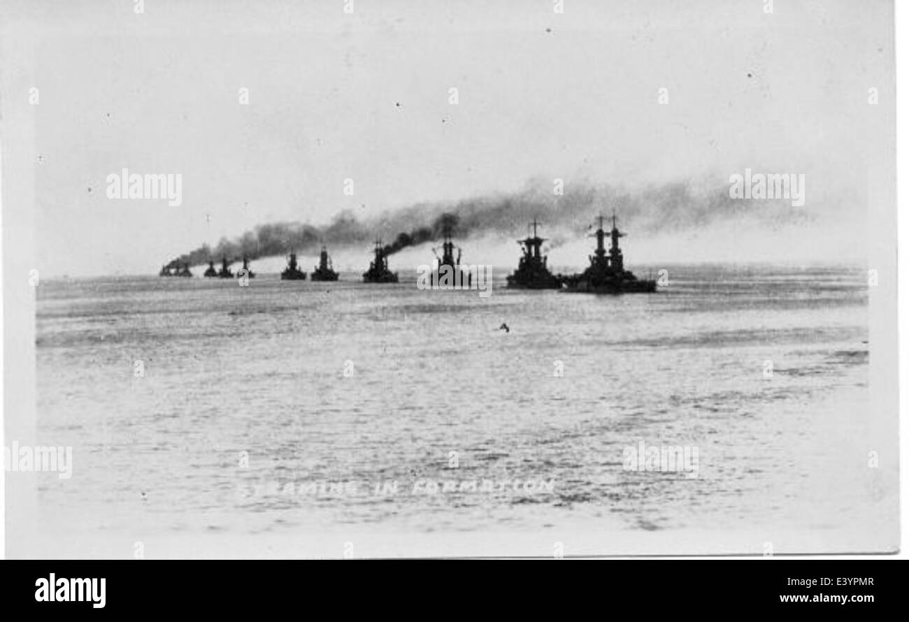 A photograph depicting multiple naval ships, including a battleship ...
