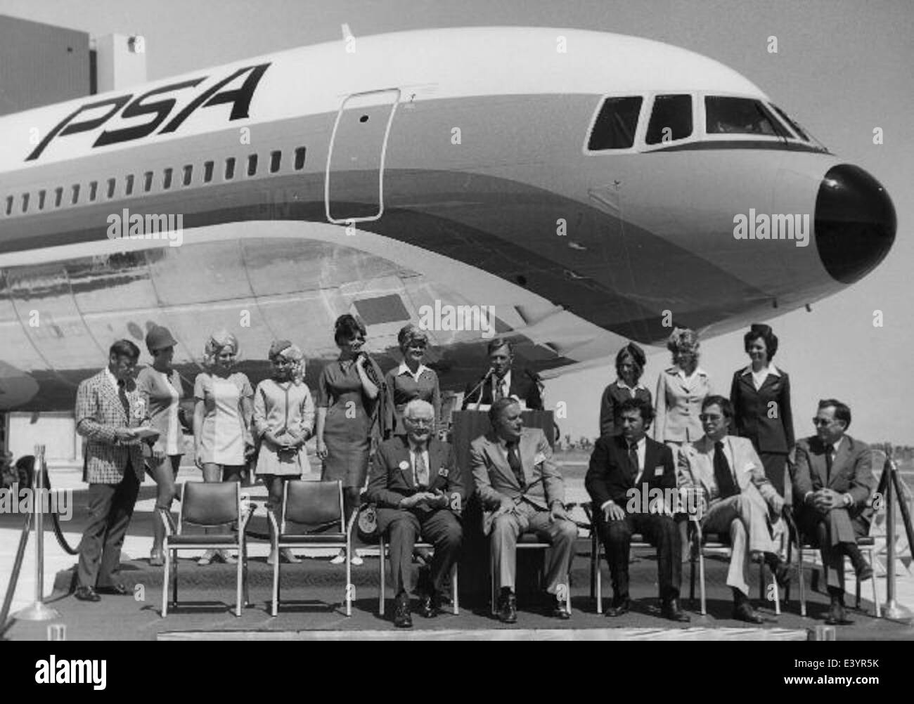 This image features a flight attendant from Pacific Southwest Airlines ...