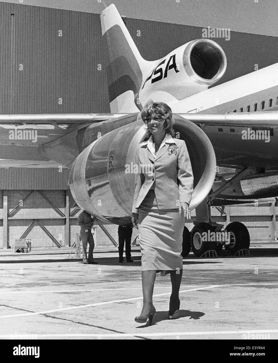 A flight attendant from Pacific Southwest Airlines (PSA) in uniform ...