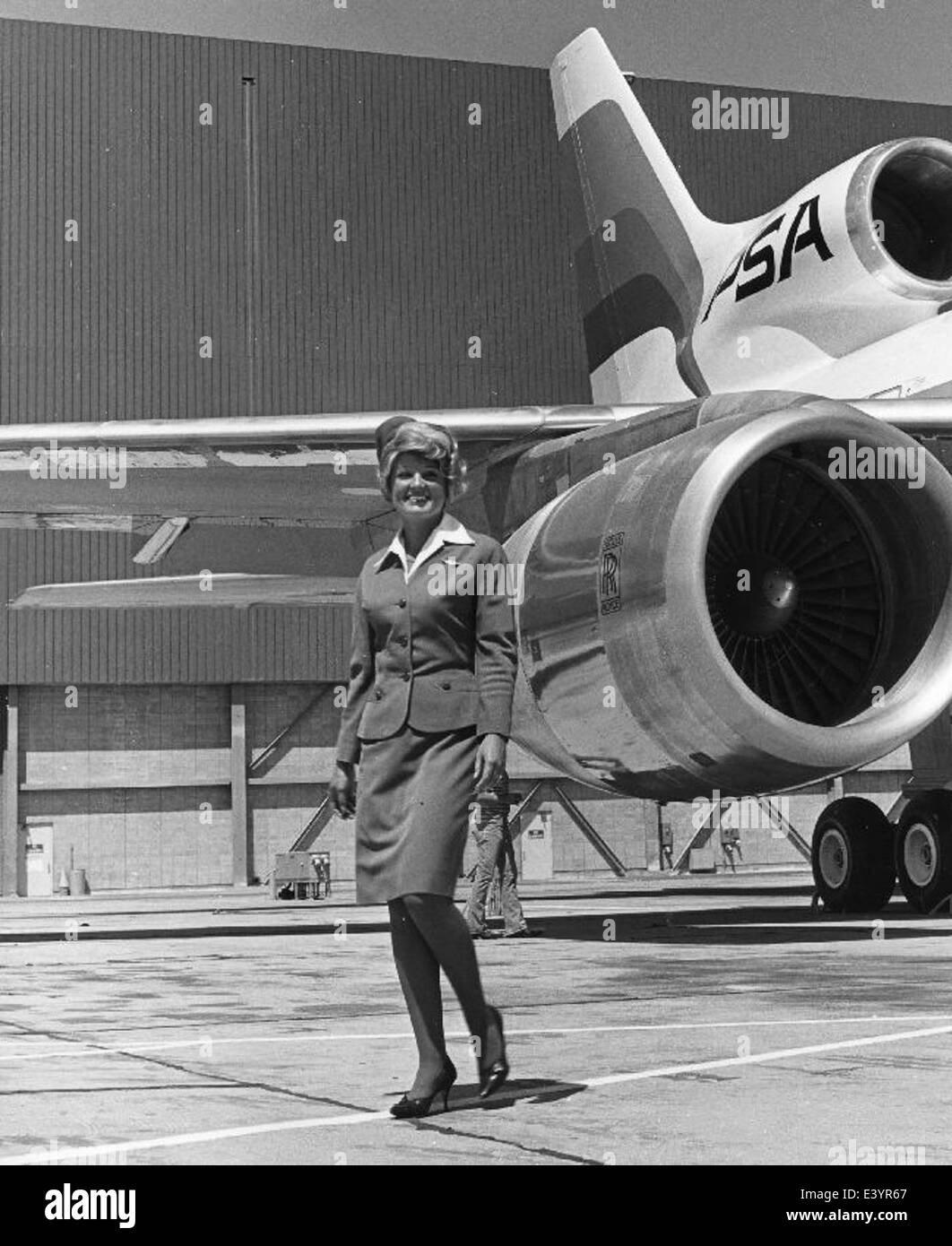 A flight attendant from Pacific Southwest Airlines (PSA) is captured in ...