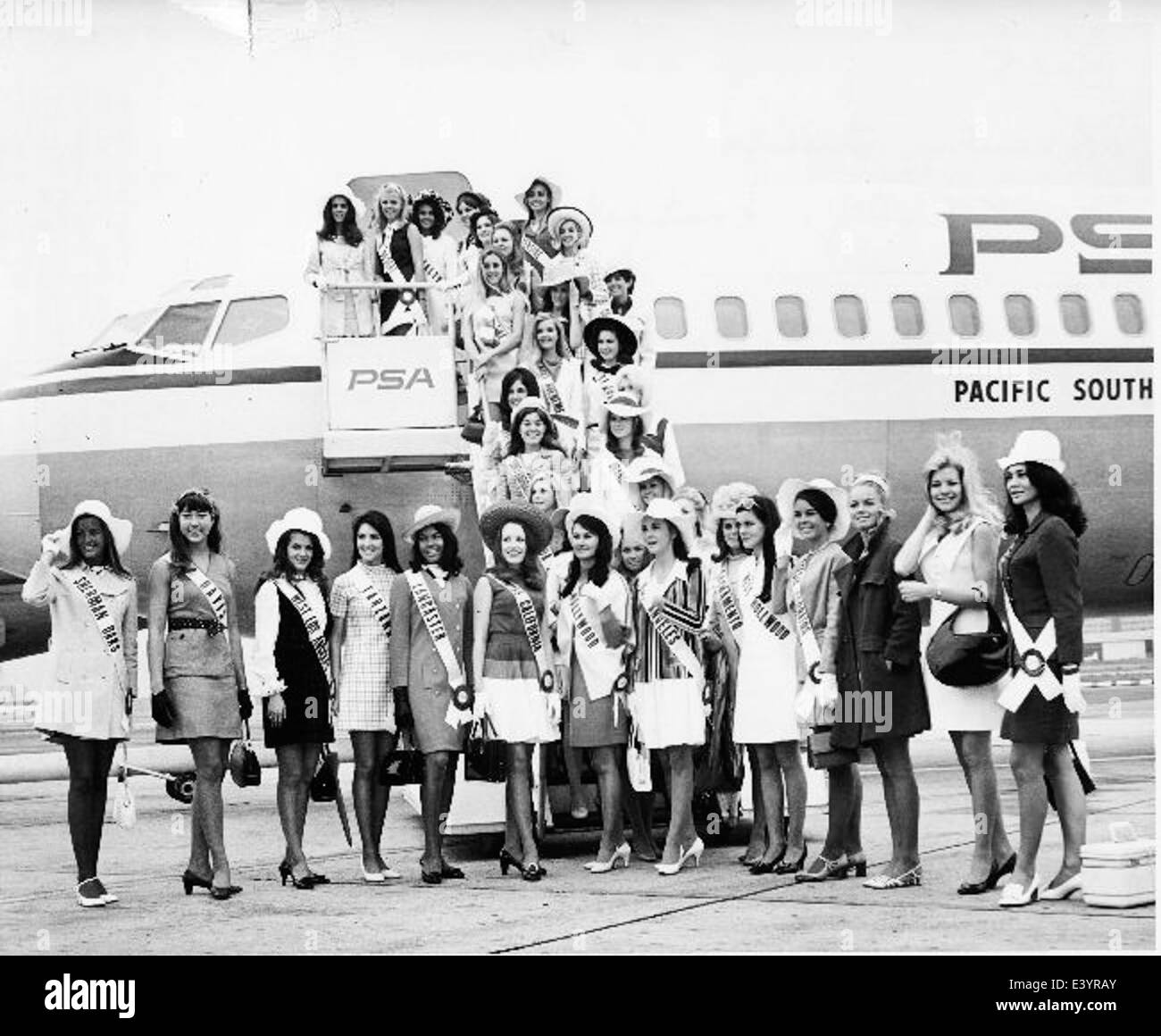 A portrait of a Pacific Southwest Airlines flight attendant in uniform ...