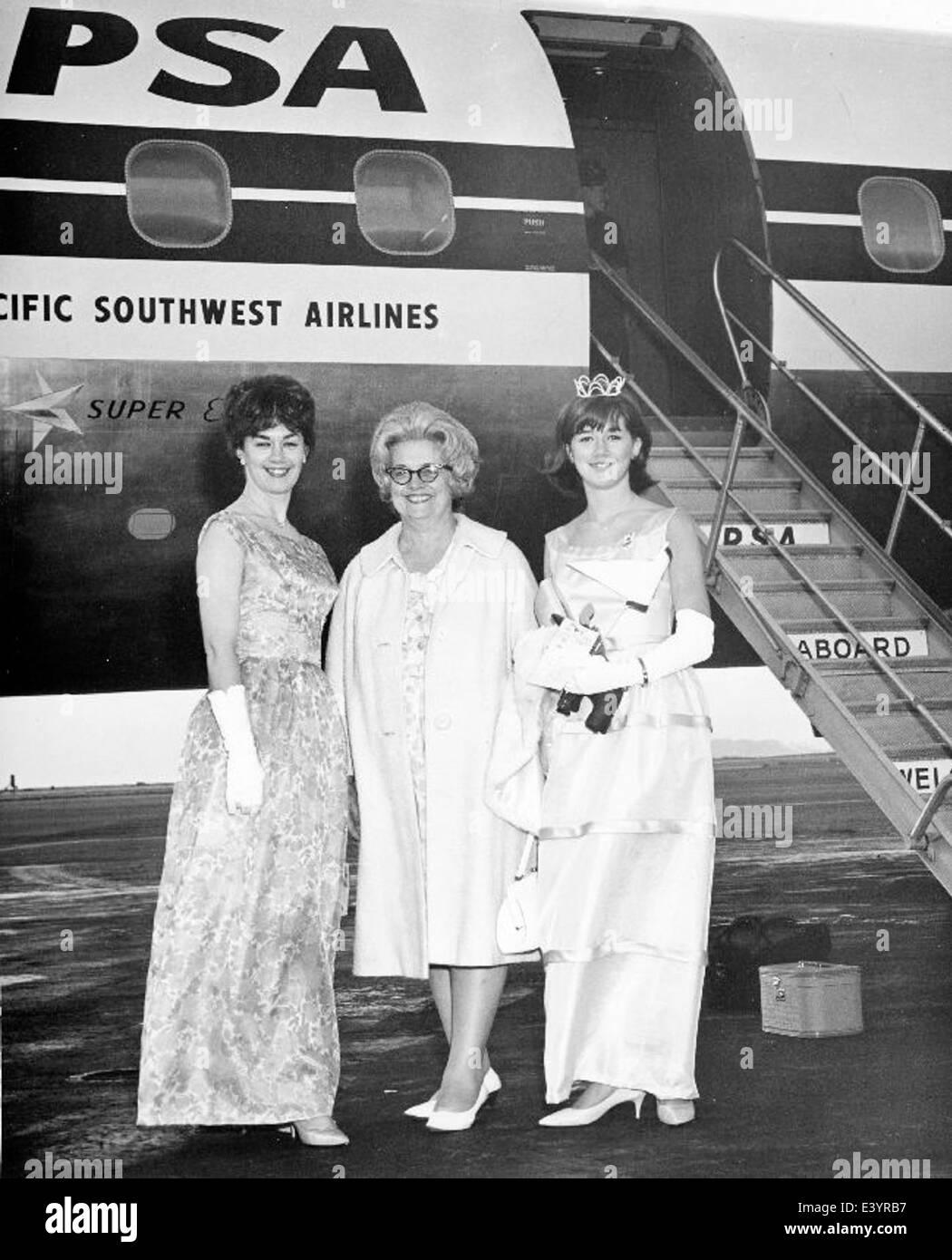 A photograph featuring a flight attendant from Pacific Southwest ...