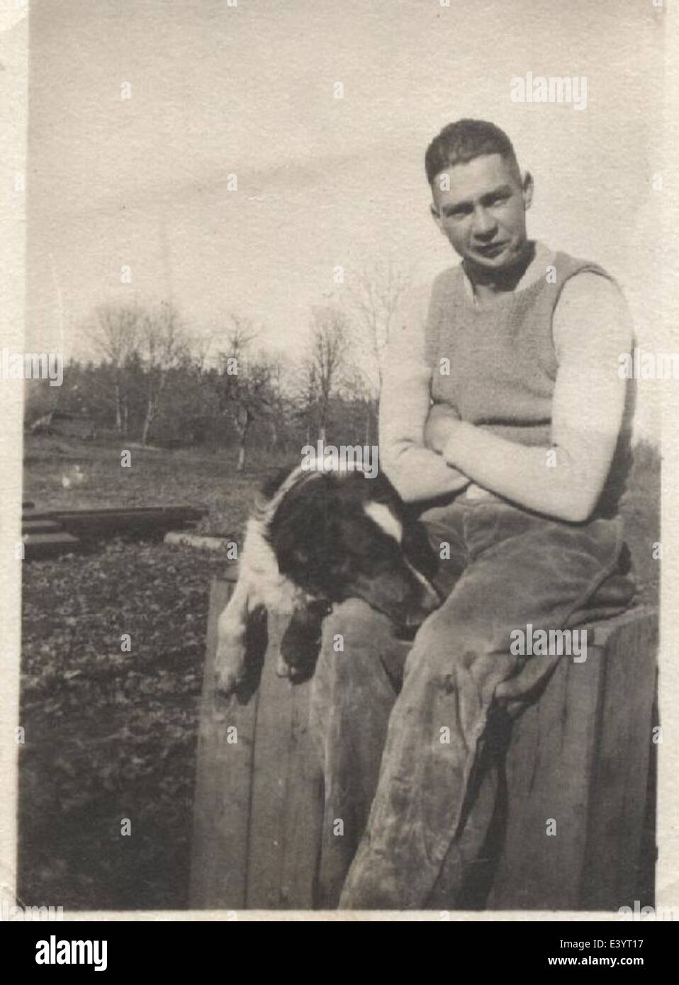 Photograph of Charles Babb with his dog, highlighting a personal moment ...