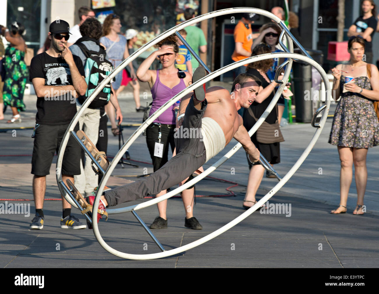 Montreal, Canada. 1st July, 2014. An acrobat performs in the street of ...
