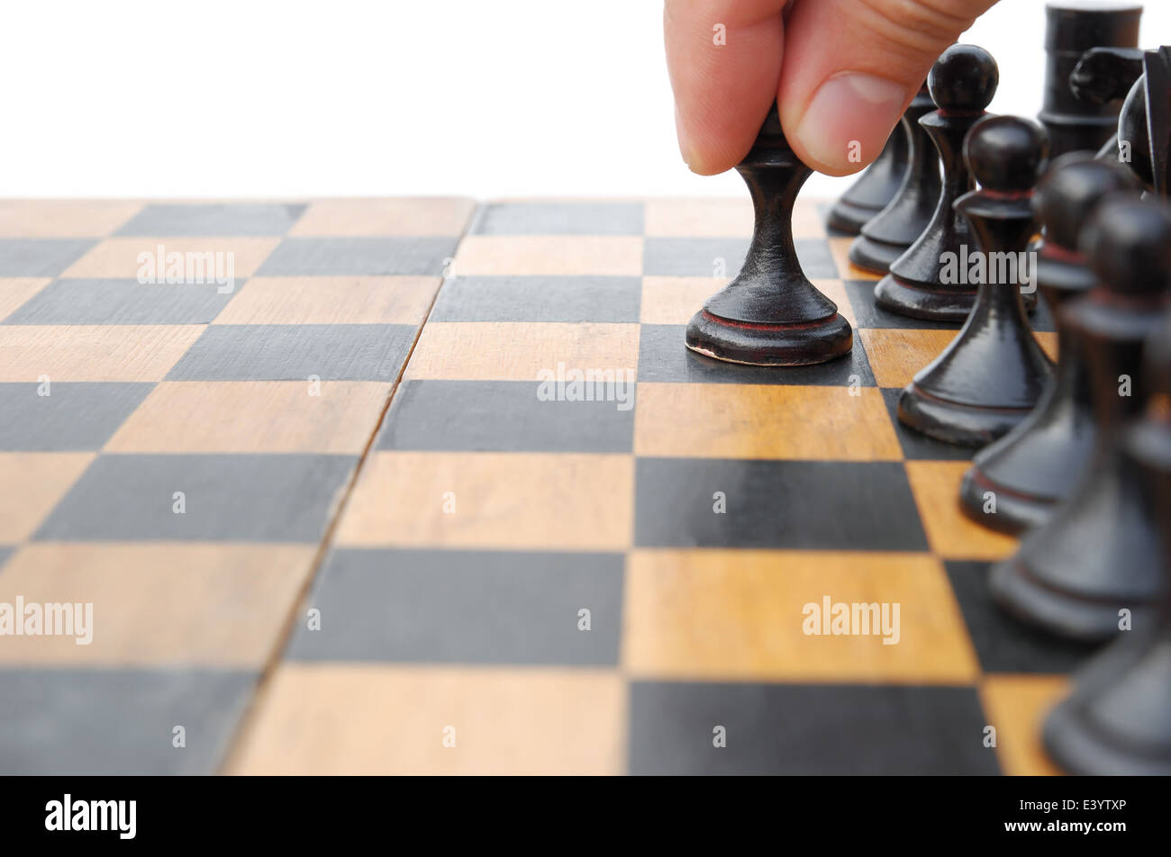 Hand moving black chess hi-res stock photography and images - Alamy