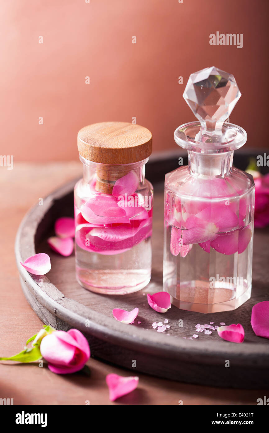 alchemy and aromatherapy set with rose flowers and flasks Stock Photo ...
