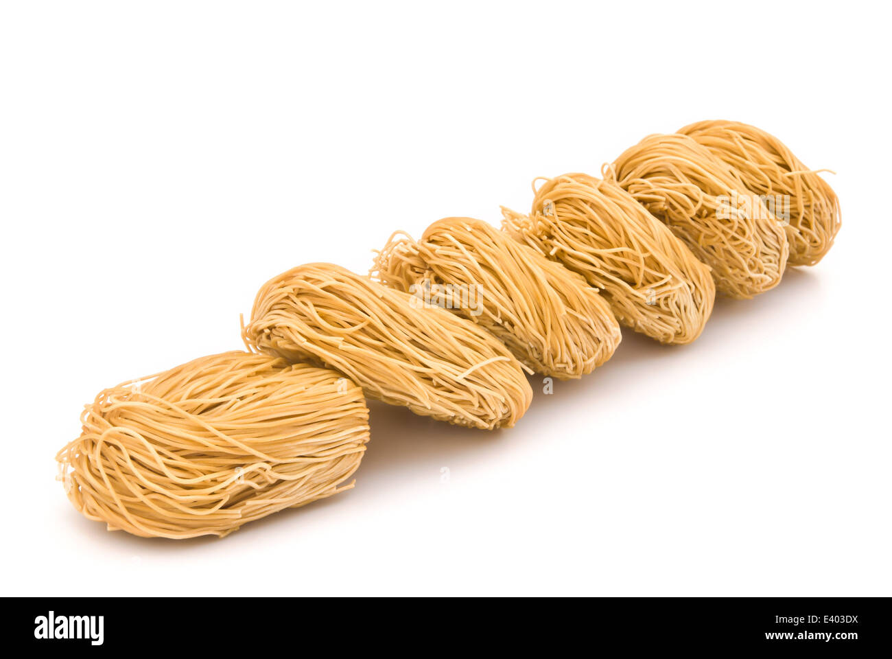 raw noodles line up on white Stock Photo - Alamy