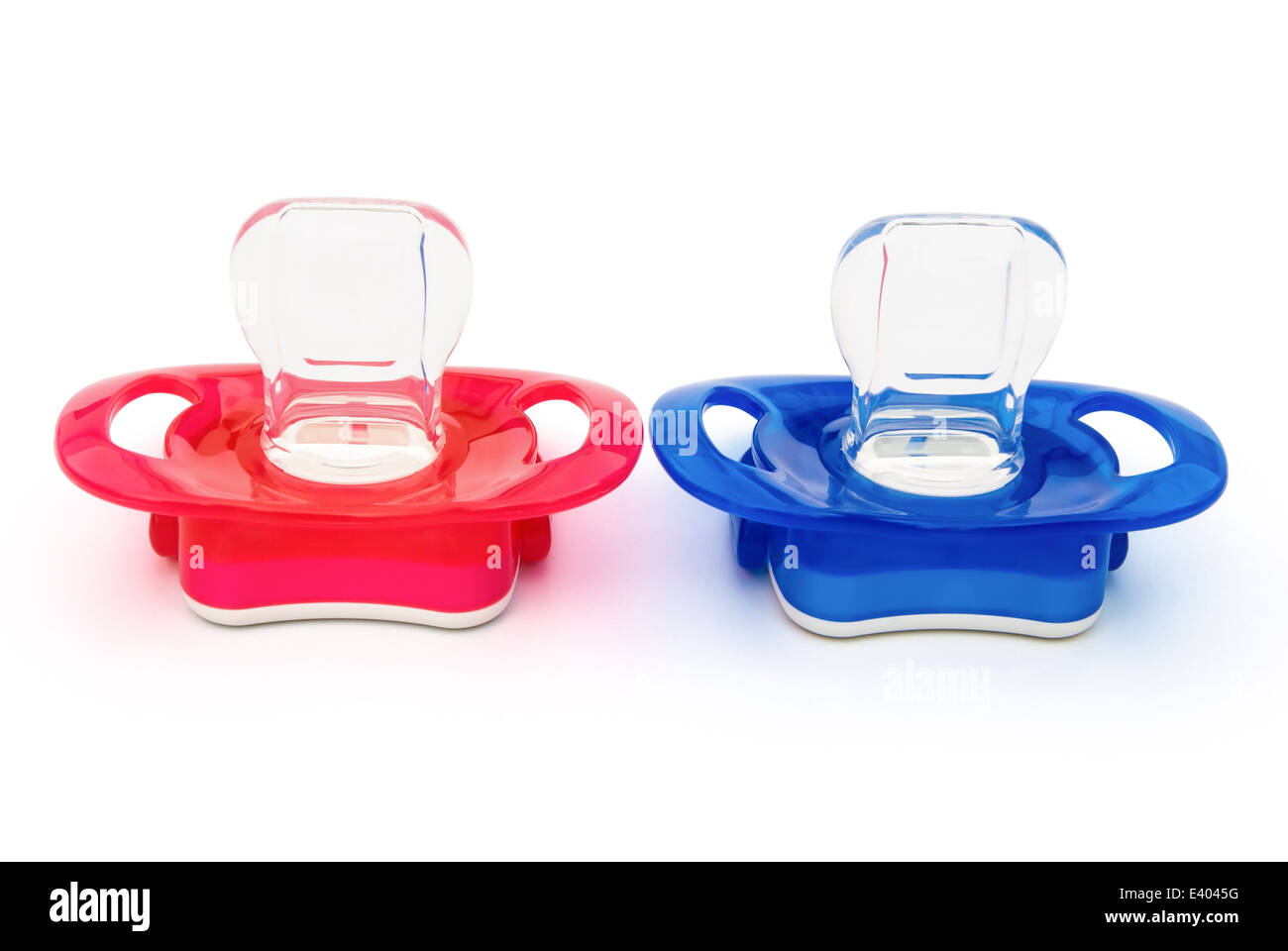 red and blue pacifiers isolated on white with clipping path Stock Photo ...