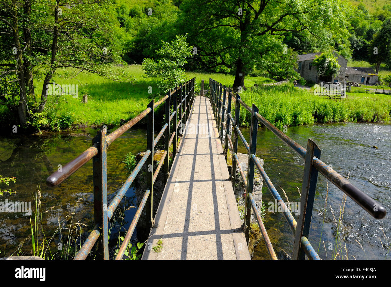 Monsal Dale.footbridge crossing the River Wye Derbyshire Peak District ...