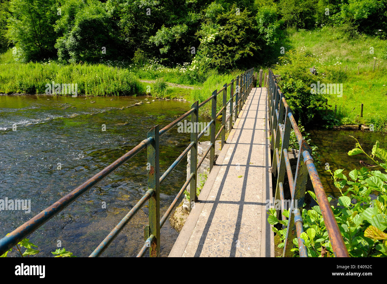 Monsal Dale.footbridge crossing the River Wye Derbyshire Peak District ...