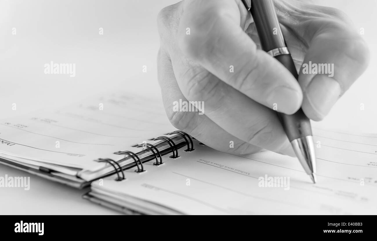 Hand blank notepad pen hi-res stock photography and images - Alamy