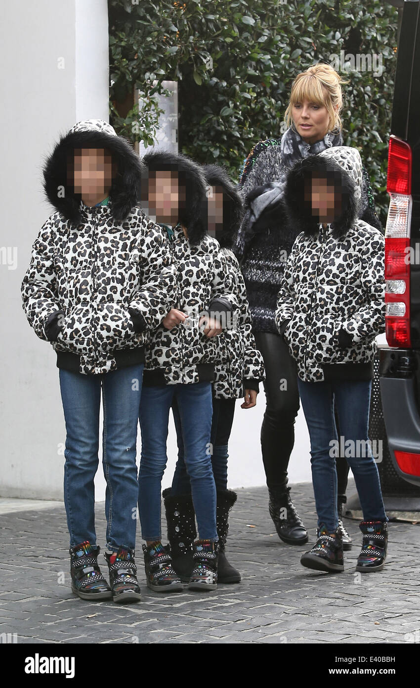 Heidi Klum takes children, wearing matching animal print coats ...