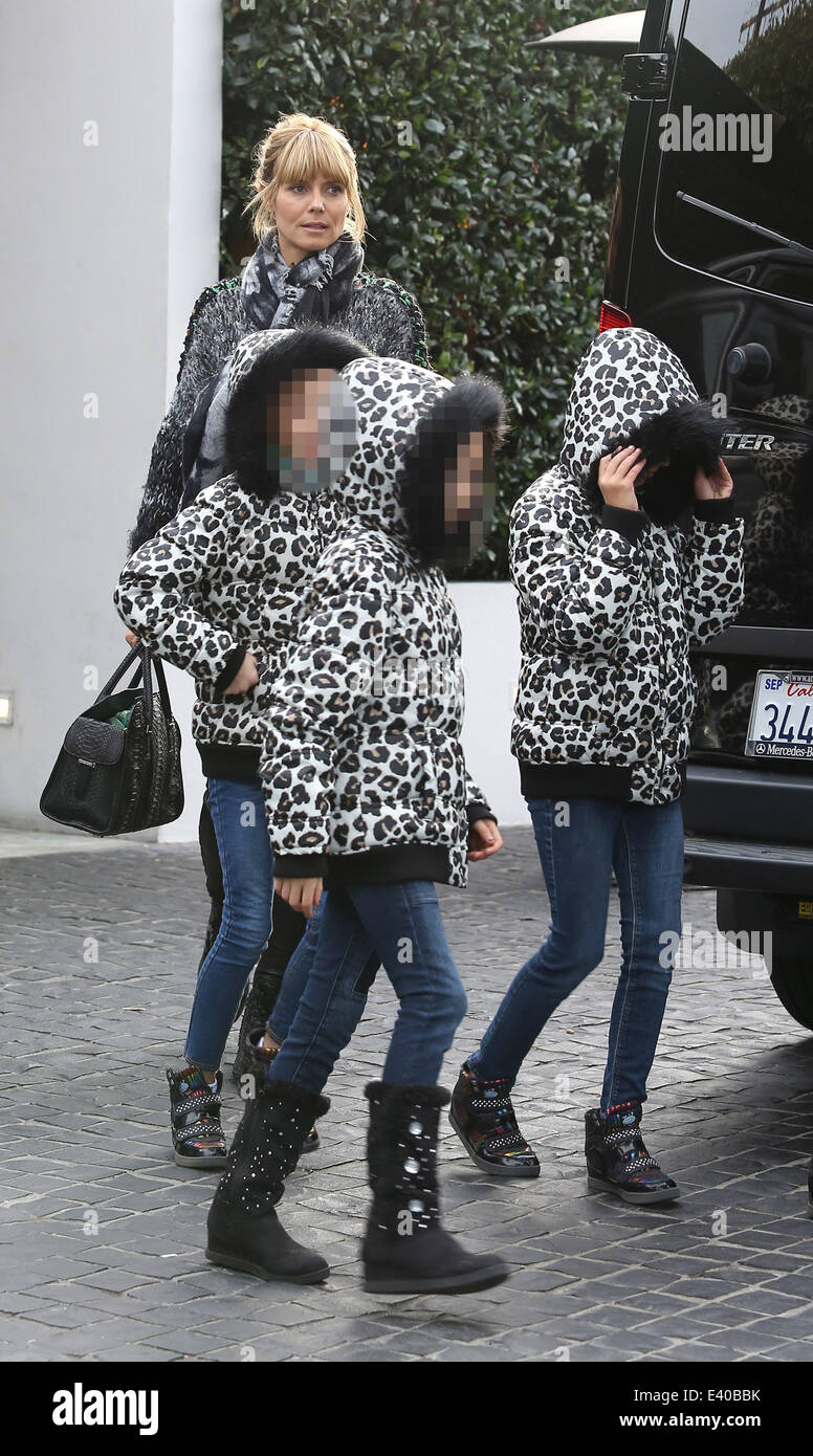 Heidi Klum takes children, wearing matching animal print coats ...