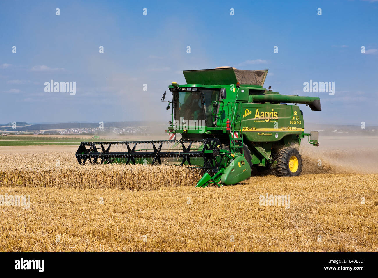 Farmer driving combine harvesting corn hi-res stock photography and ...