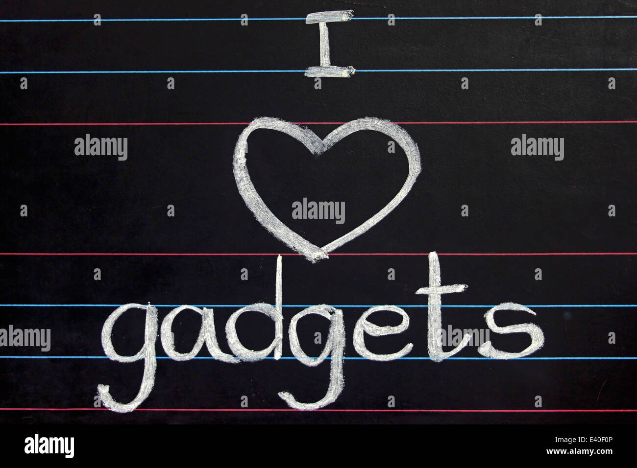 I Love gadgets phrase handwritten on blackboard Stock Photo - Alamy