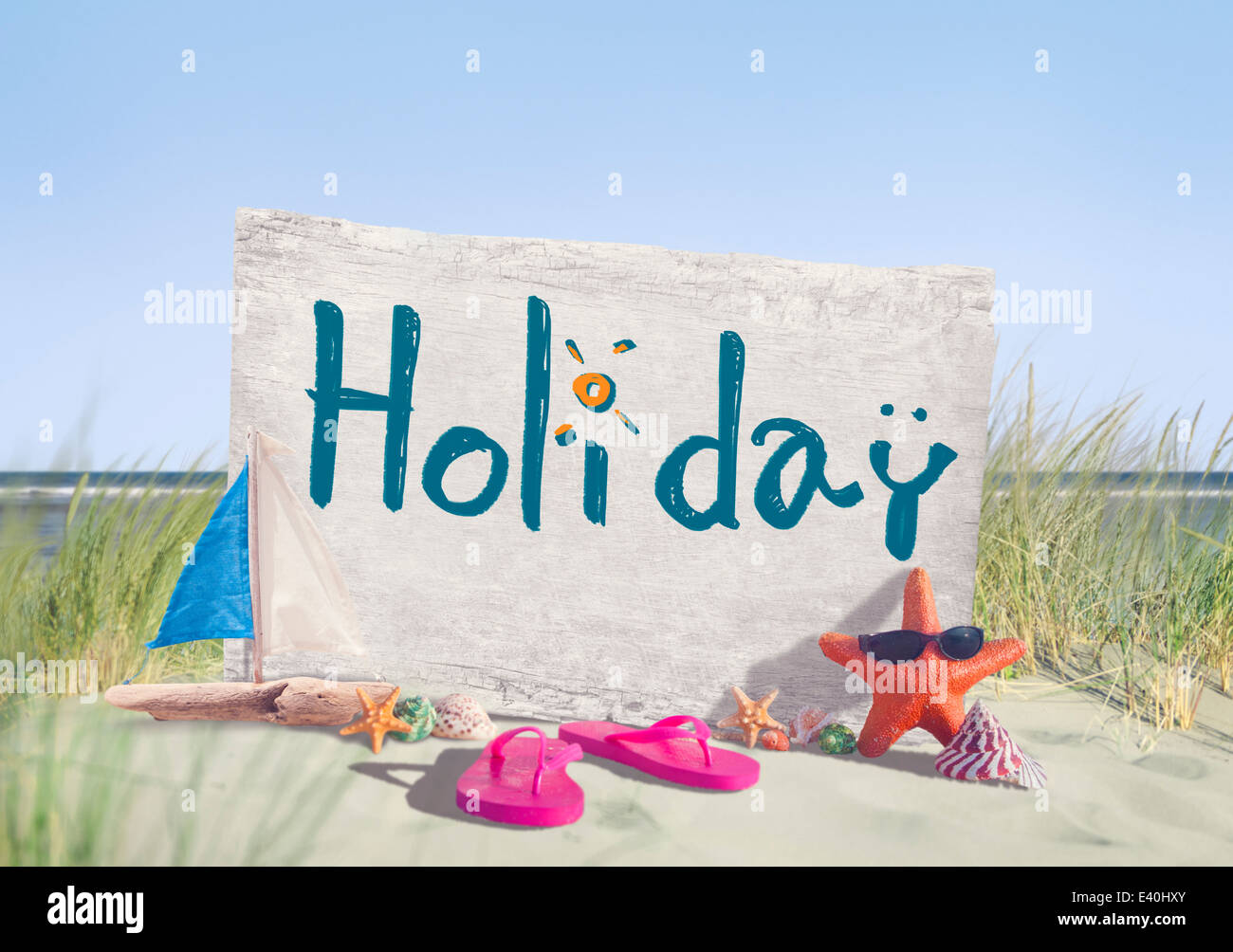 Holiday Signboard and Summer Props on Beach Stock Photo - Alamy