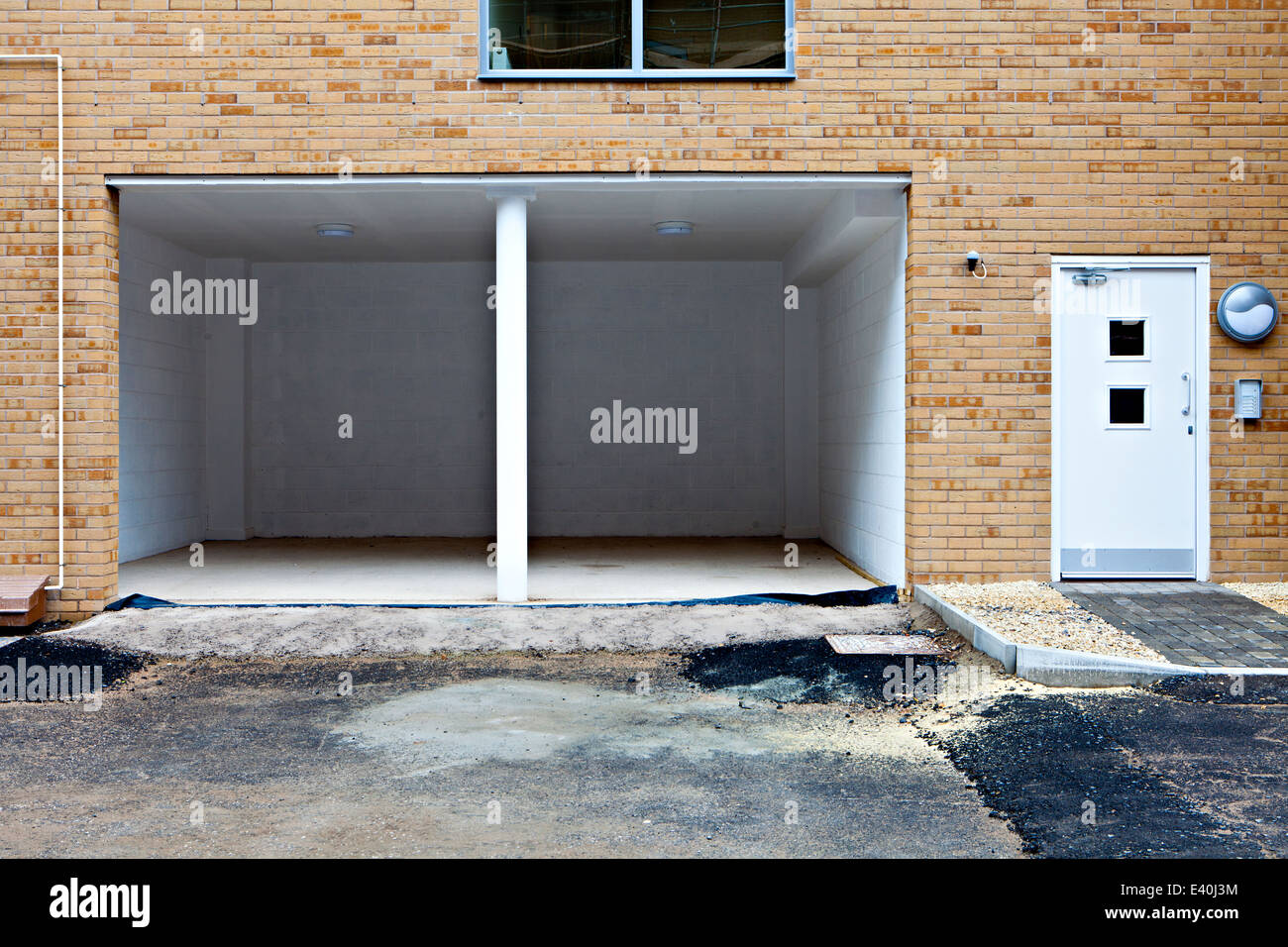 Two integral garages and front door in new housing development during ...