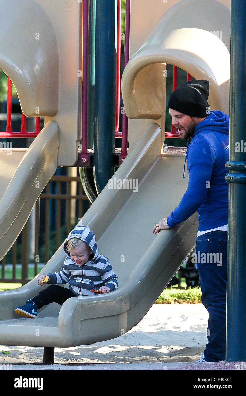 Mike Comrie takes his son Luca to play on the swings and slides at a ...