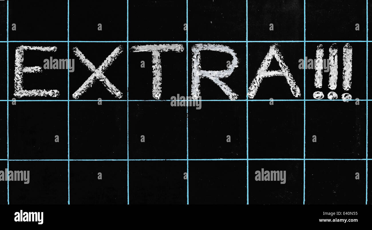extra word handwritten on black chalkboard Stock Photo - Alamy
