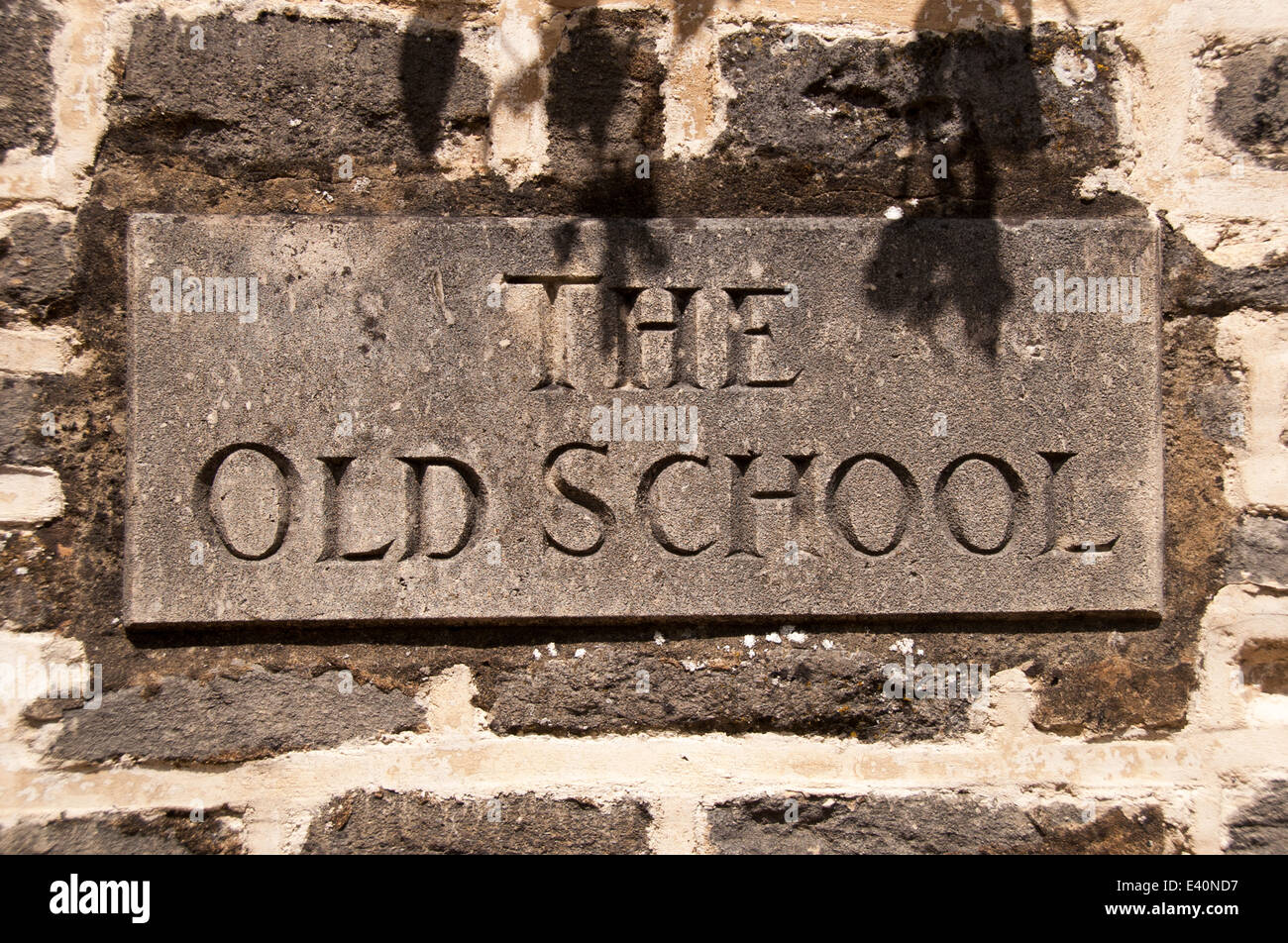 Stone mason sign outside a school gate Stock Photo - Alamy