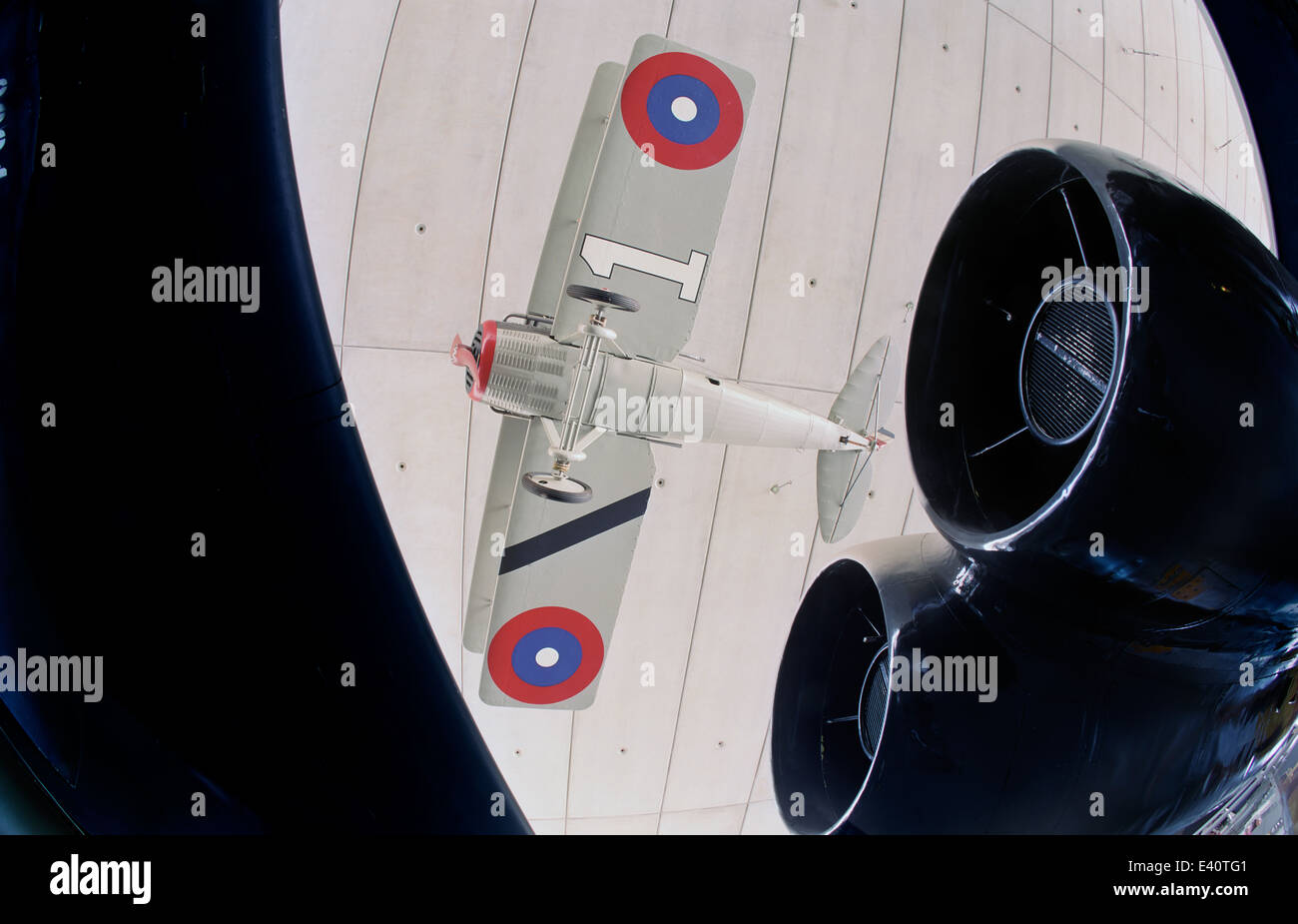 spad biplane museum exhibit framed by jet engine of B 52 bomber and ...