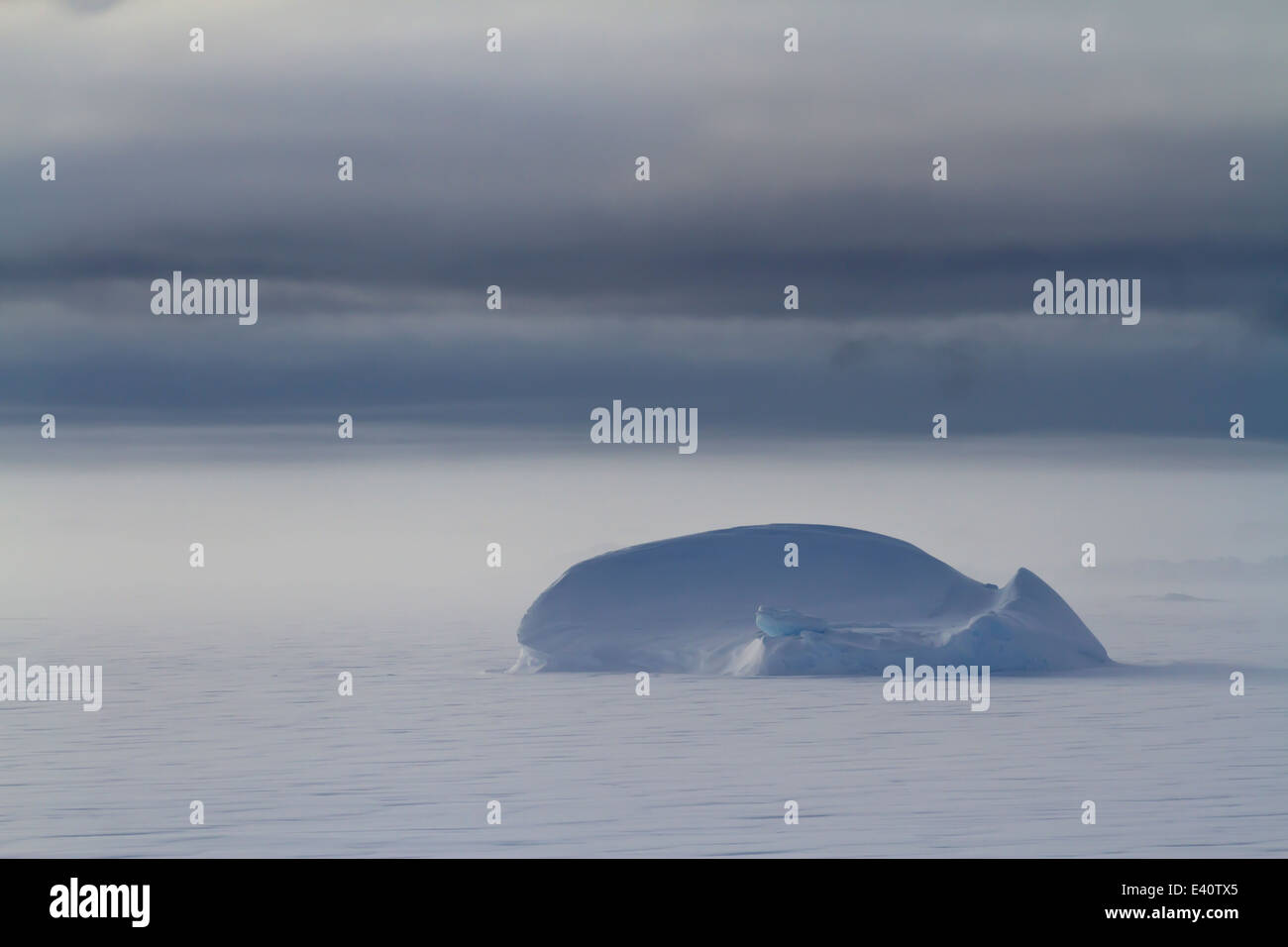small iceberg that frozen Antarctic waters on a cloudy misty day Stock ...