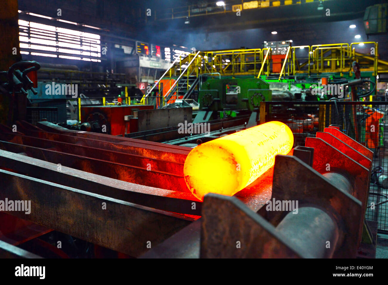 Glowing crude steel in a tube rolling mill Stock Photo - Alamy