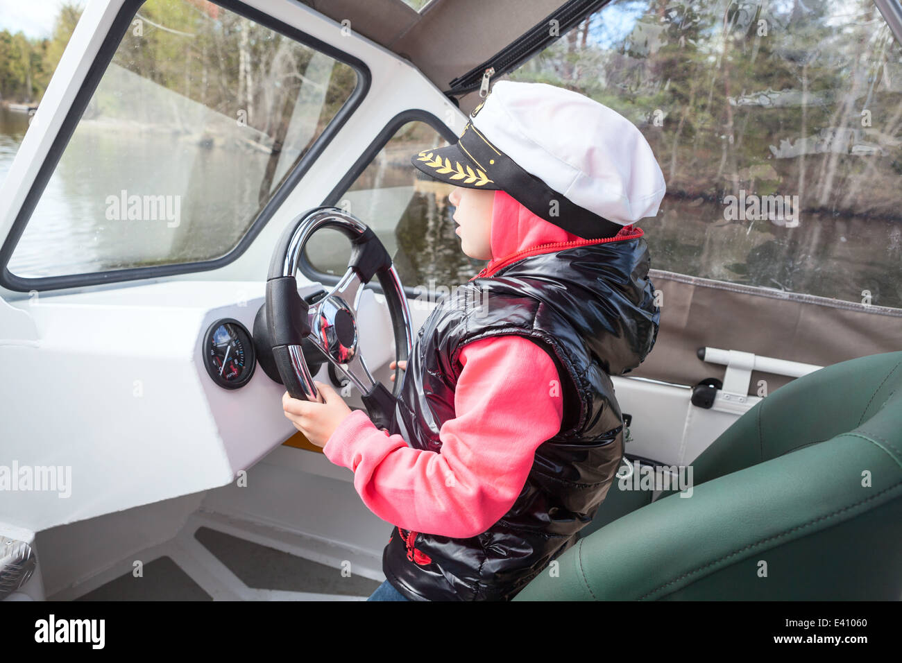 Child girl sailing steering boat hi-res stock photography and images ...