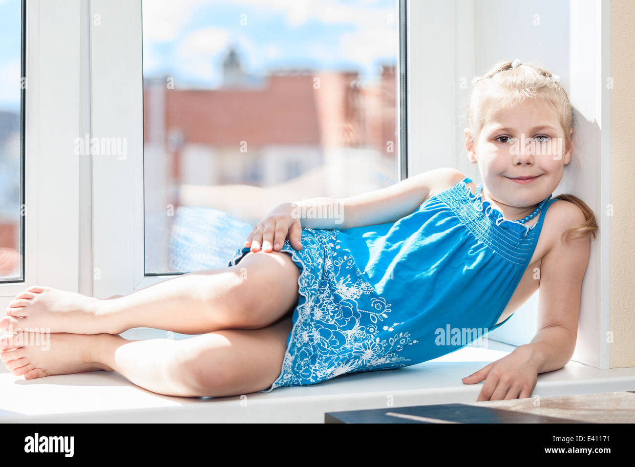 Child laying in sun hi-res stock photography and images - Alamy