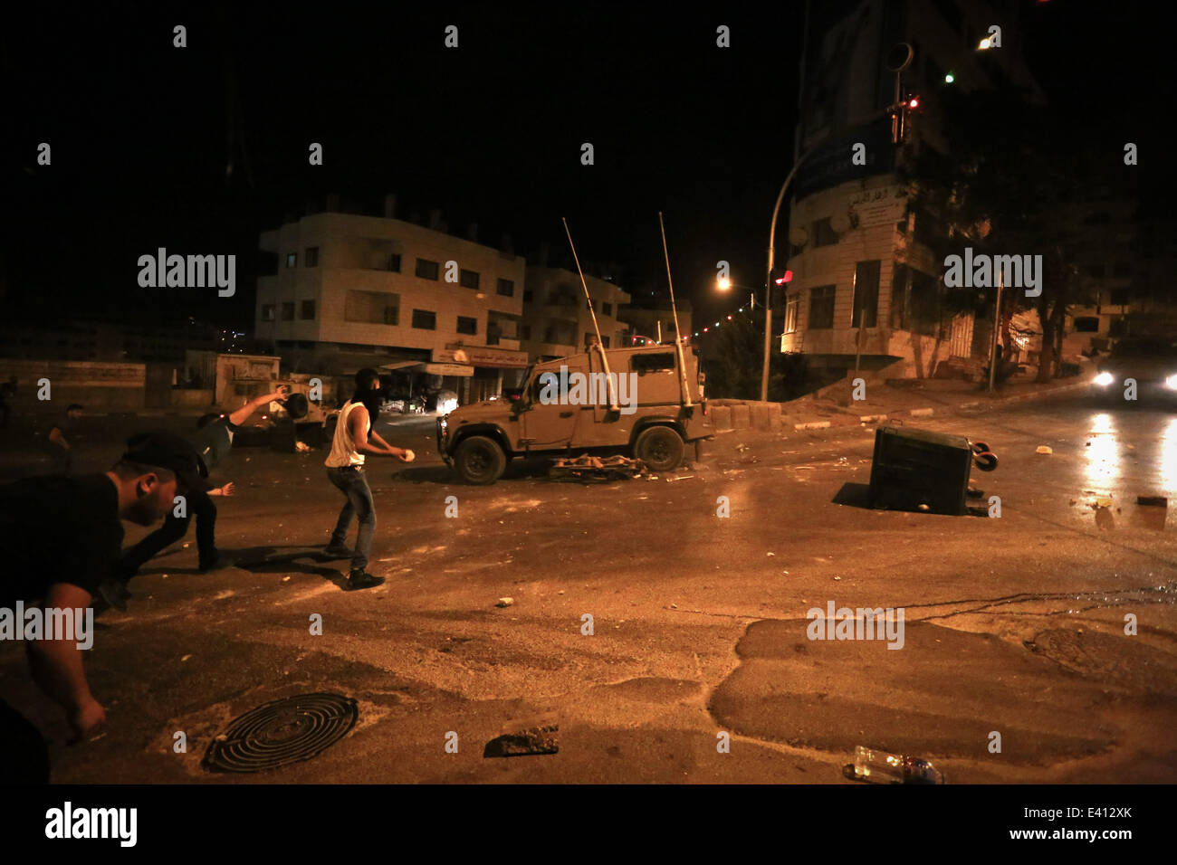 Nablus City, West Bank. 2nd July, 2014. Palestinian protesters threw ...