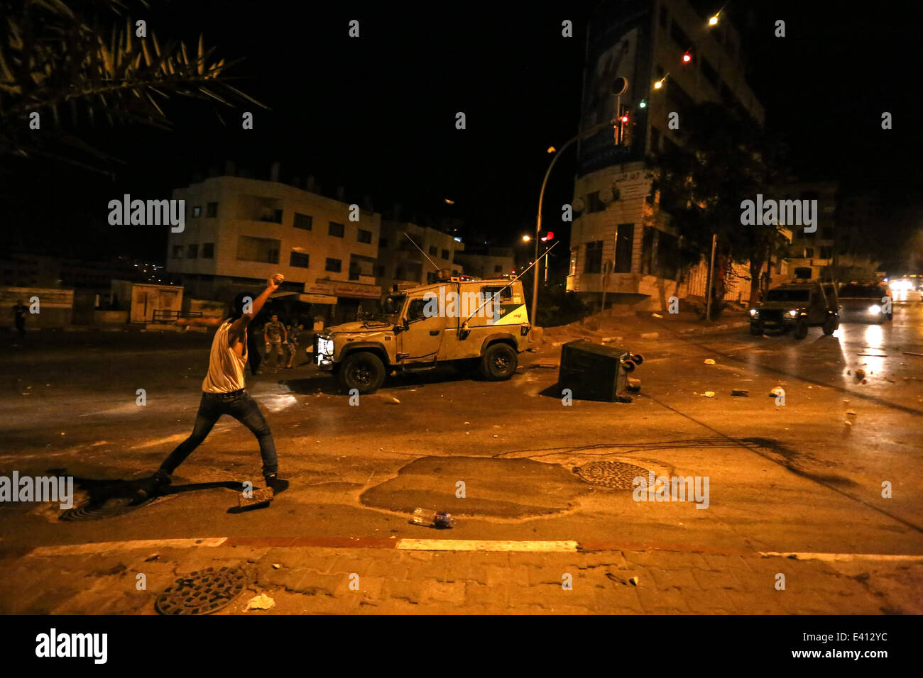 Nablus City, West Bank. 2nd July, 2014. Palestinian protesters threw ...