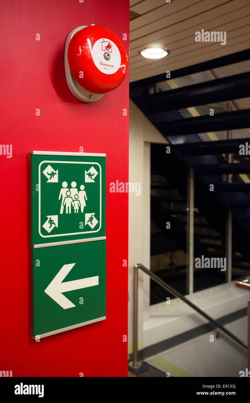 Sign post and alarm bell at ferry Stock Photo - Alamy